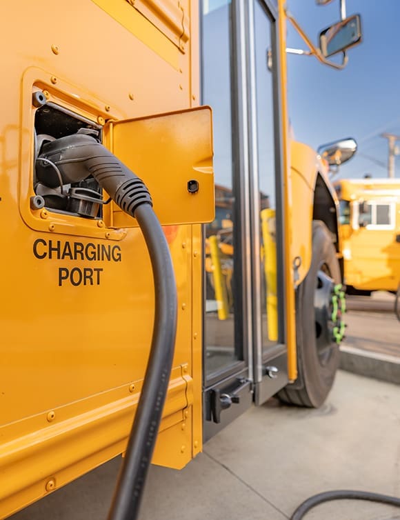 Yellow,Electric,School,Bus,Plugged,In,At,A,Charging,Station. - New ...